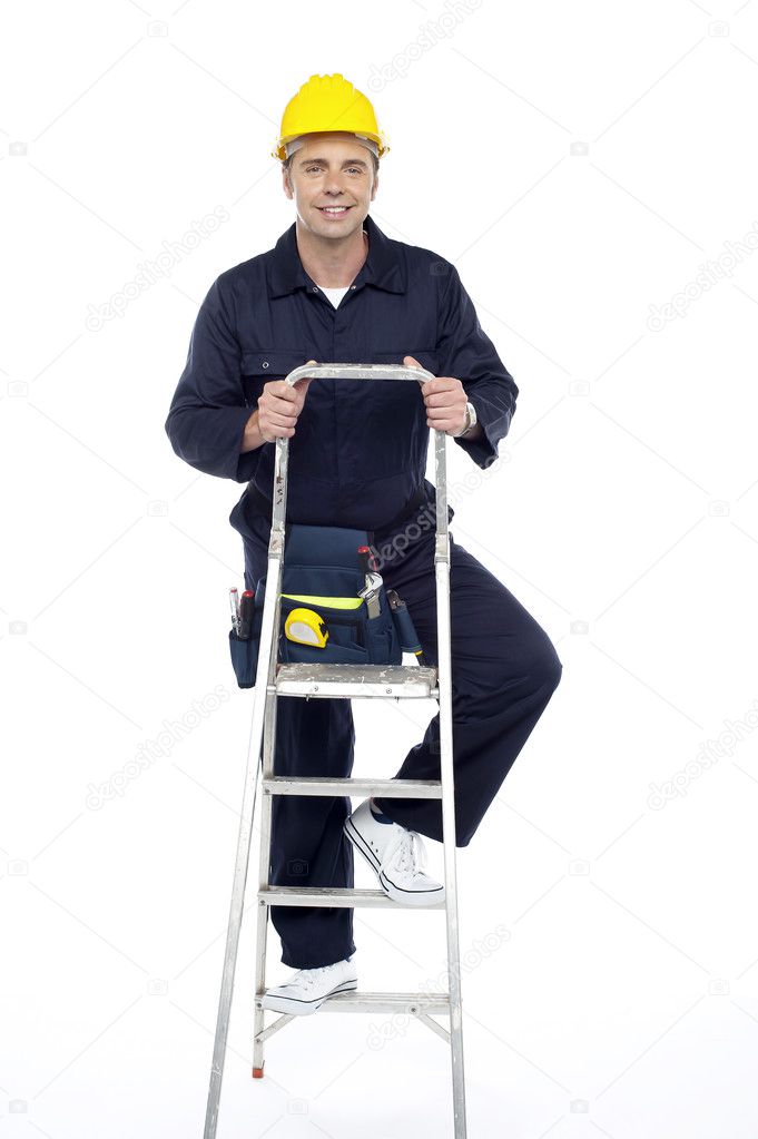 Its work time. Repairman climbing stepladder Stock Photo by ...