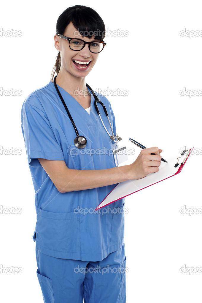 Medical nurse jotting down notes on writing pad — Stock Photo ...