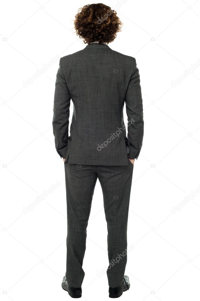 Back pose of a man in gray formals Stock Photo by ©stockyimages 24550835
