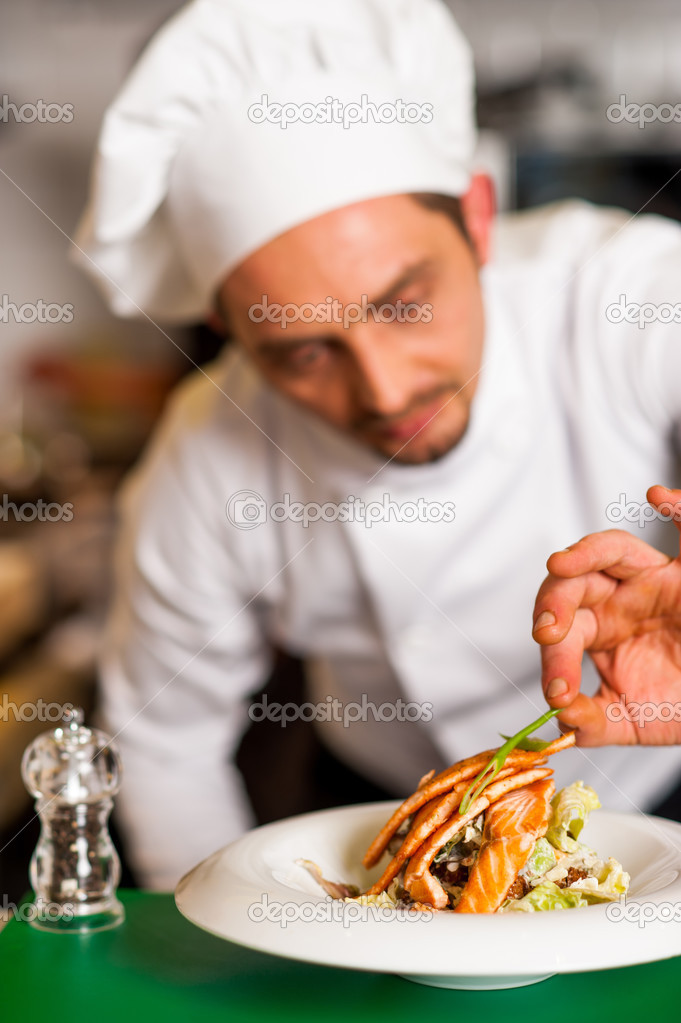 Professional chef preparing baked salmon to be served — Stock Photo ...
