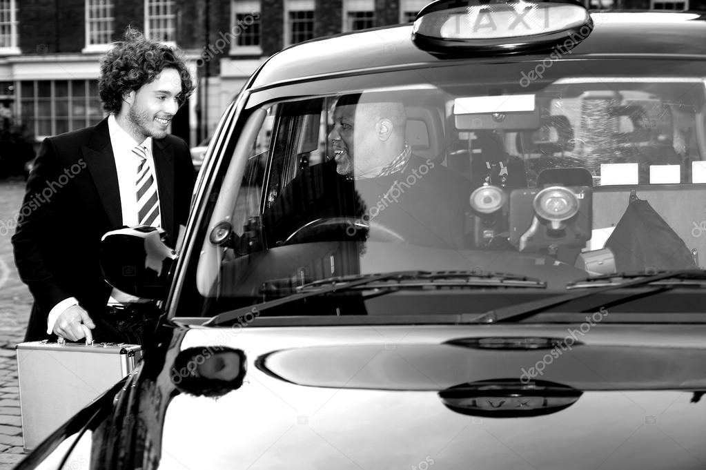 Male passenger communicating with taxi driver Stock Photo by ...