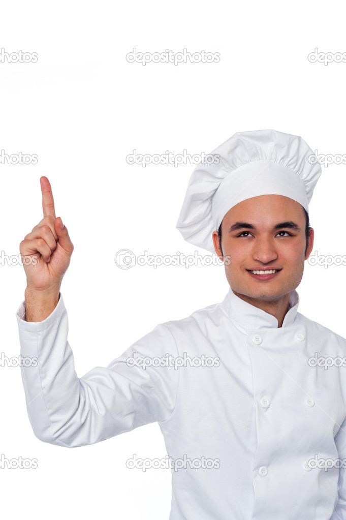 Male chef looking and pointing upwards — Stock Photo © stockyimages ...