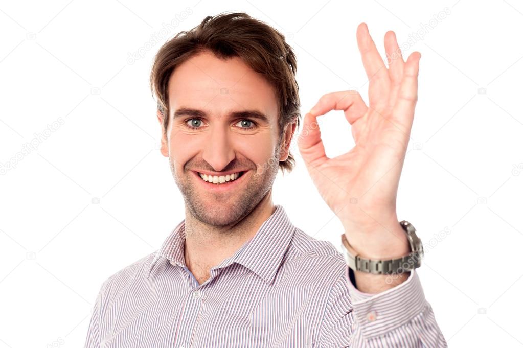 Smart man showing okay sign — Stock Photo © stockyimages #30790345