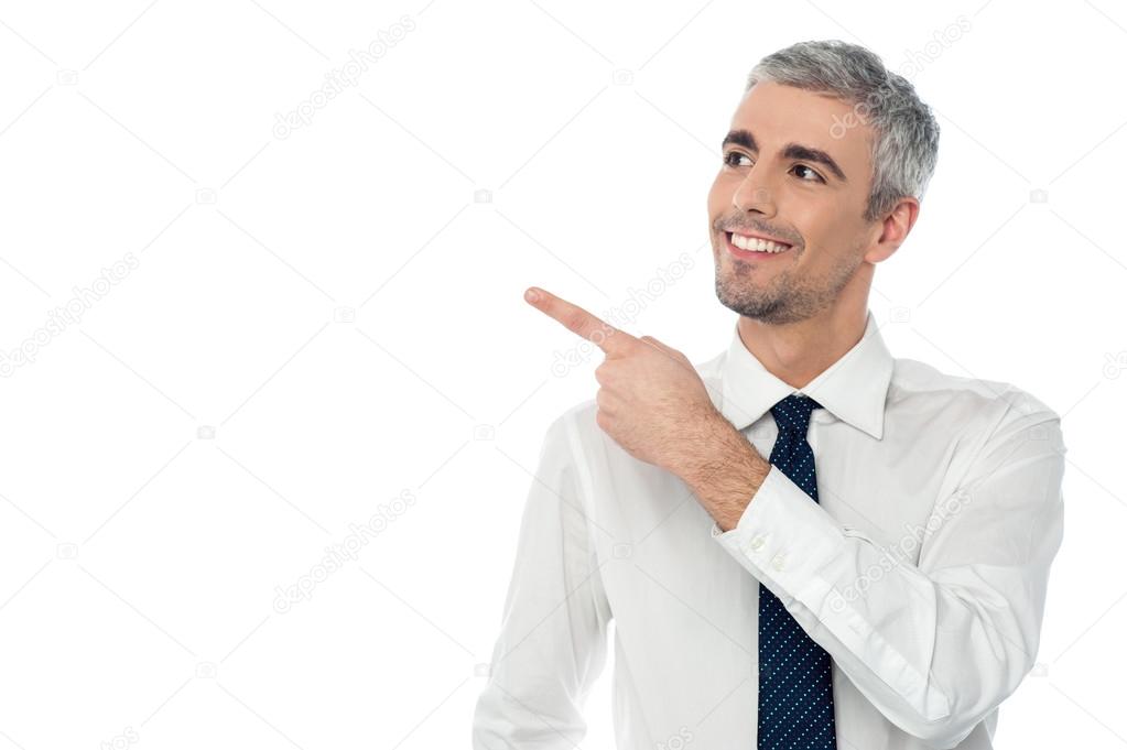 Happy man pointing at something Stock Photo by ©stockyimages 46201793 Happy man pointing at something Stock Photo by ©stockyimages 46201793
