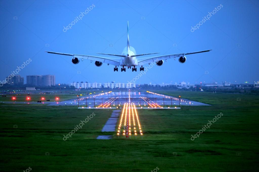 Passenger plane fly up over take-off runway from airport Stock Photo by ...