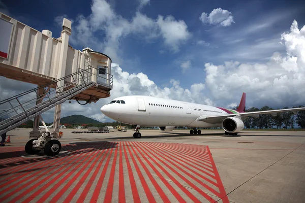 Passenger plane fly up over take-off runway from airport — Stock Photo ...
