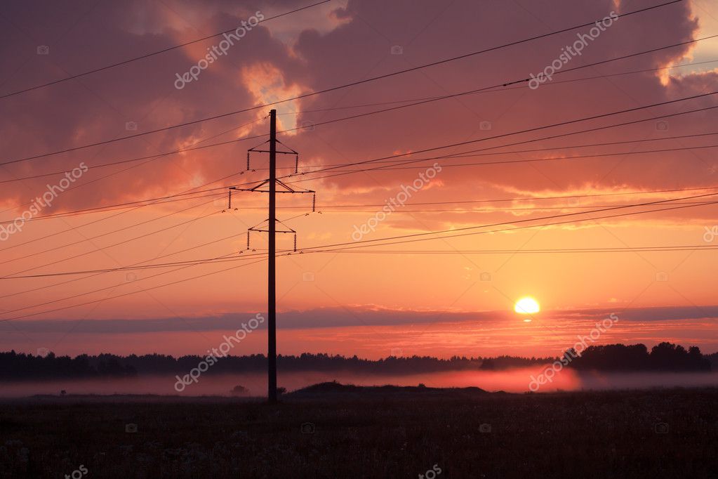 High voltage power lines, fog and sunset — Stock Photo © romantsubin ...