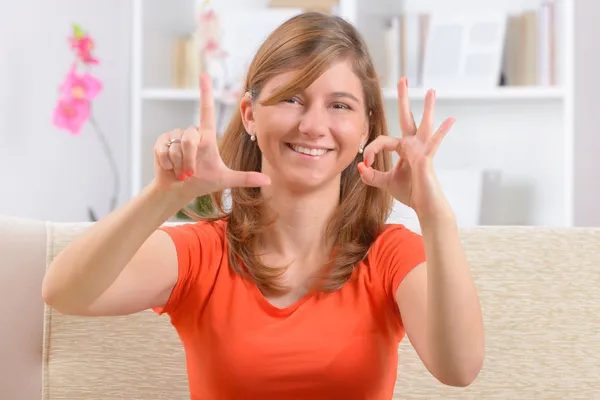 Deaf woman learning sign language Stock Photo by ©Amaviael 58808127