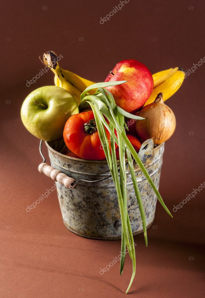 Bucket with fruits Stock Photo by ©Kaminska 18803973