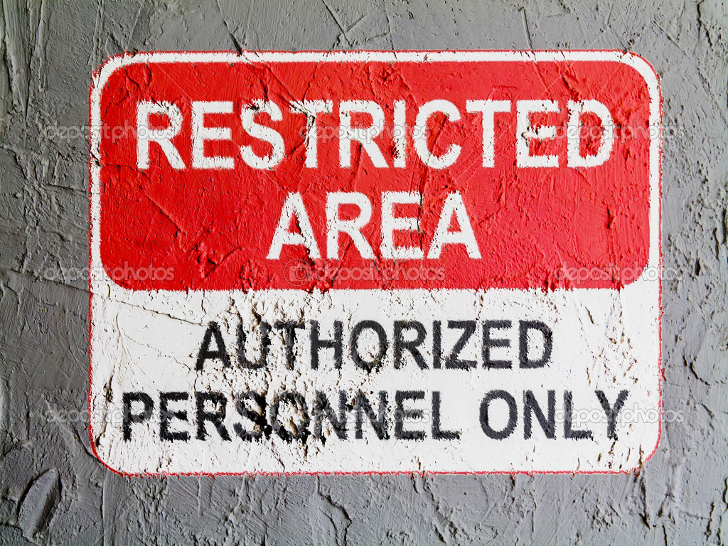 Restricted area sign painted on wall — Stock Photo © Olesha #15389385