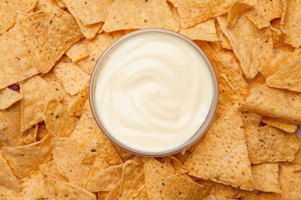 Bowl of dip placed among nachos — Stock Photo © Wavebreakmedia #13963810
