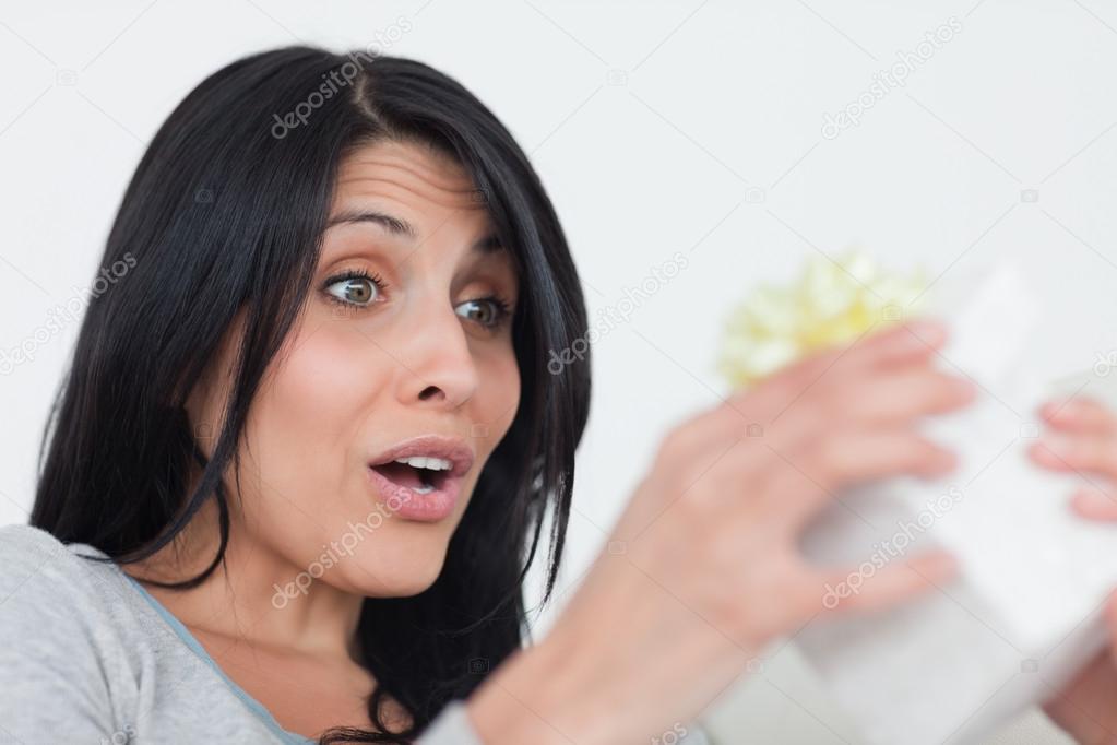 Surprised woman opening a gift box — Stock Photo © Wavebreakmedia #14070319