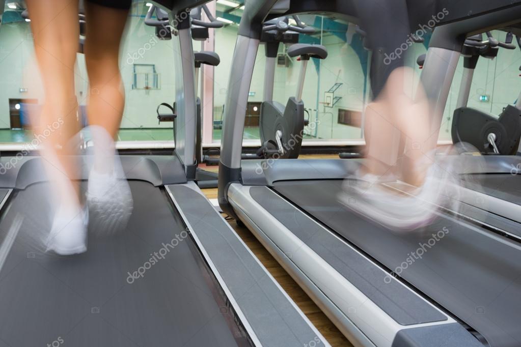 Running on a treadmill in the gym — Stock Photo © Wavebreakmedia #23045990