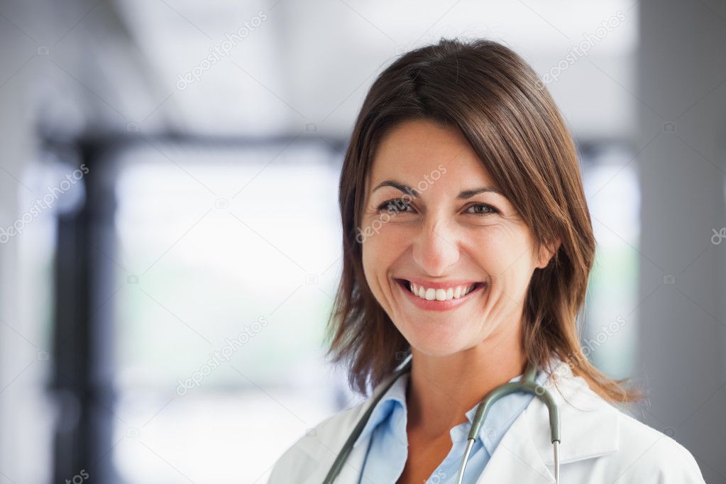 Smiling female doctor — Stock Photo © Wavebreakmedia #23046368 Smiling female doctor — Stock Photo © Wavebreakmedia #23046368