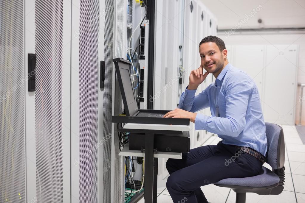 Man looking up from working with servers — Stock Photo © Wavebreakmedia ...