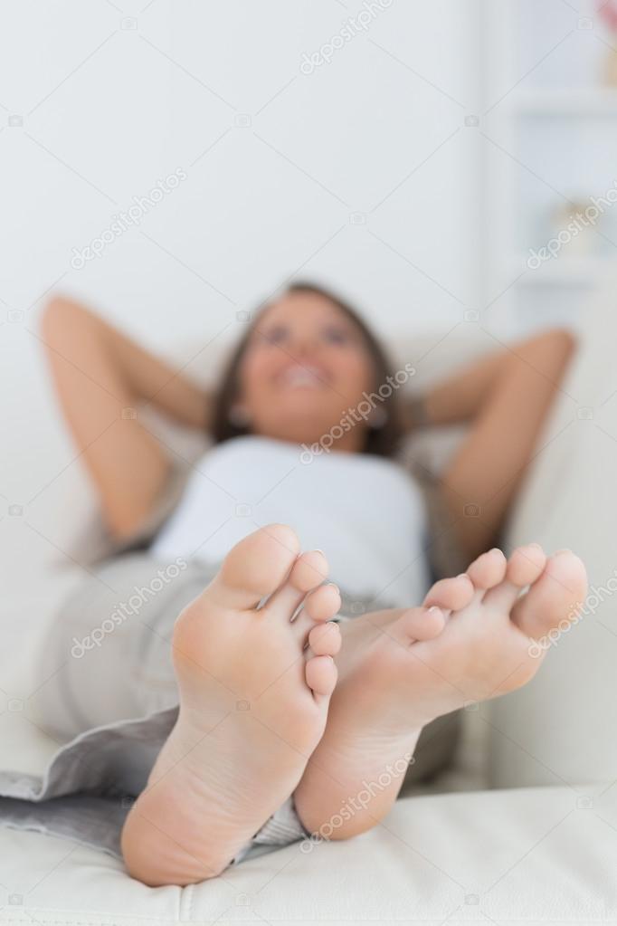 Woman relaxing with her feet up Stock Photo by ©Wavebreakmedia 23102886