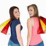 Two women with shopping bags Stock Photo by ©Wavebreakmedia 23491295