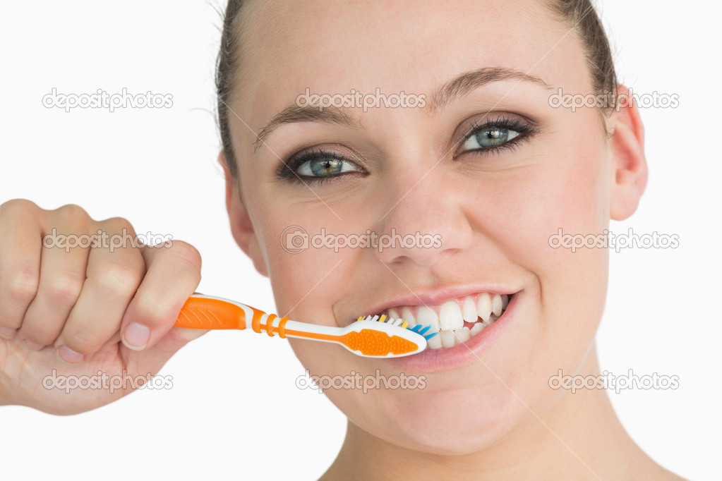 Woman washing her teeth Stock Photo by ©Wavebreakmedia 23486387
