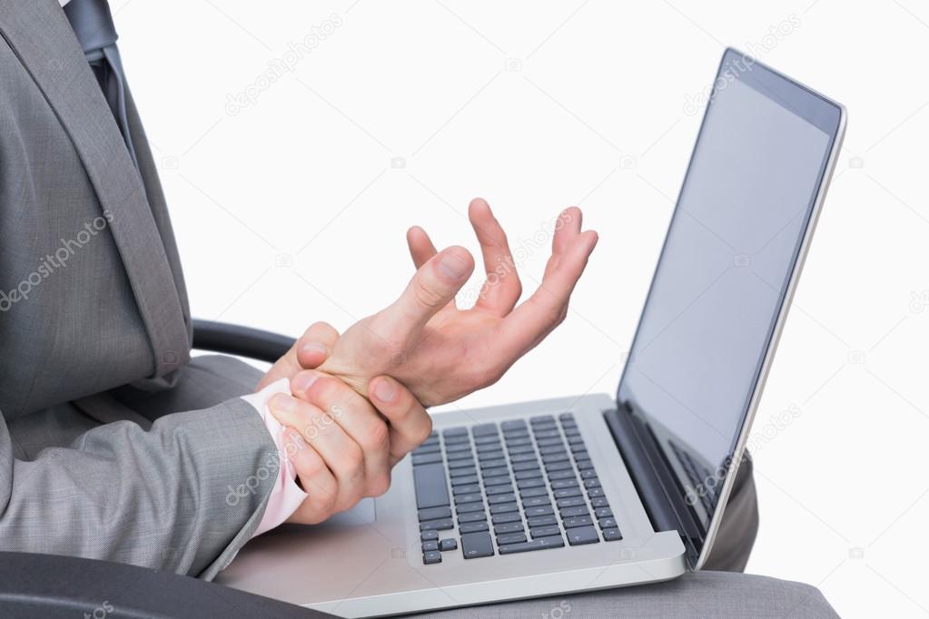 Business man with wrist pain while using laptop — Stock Photo ...