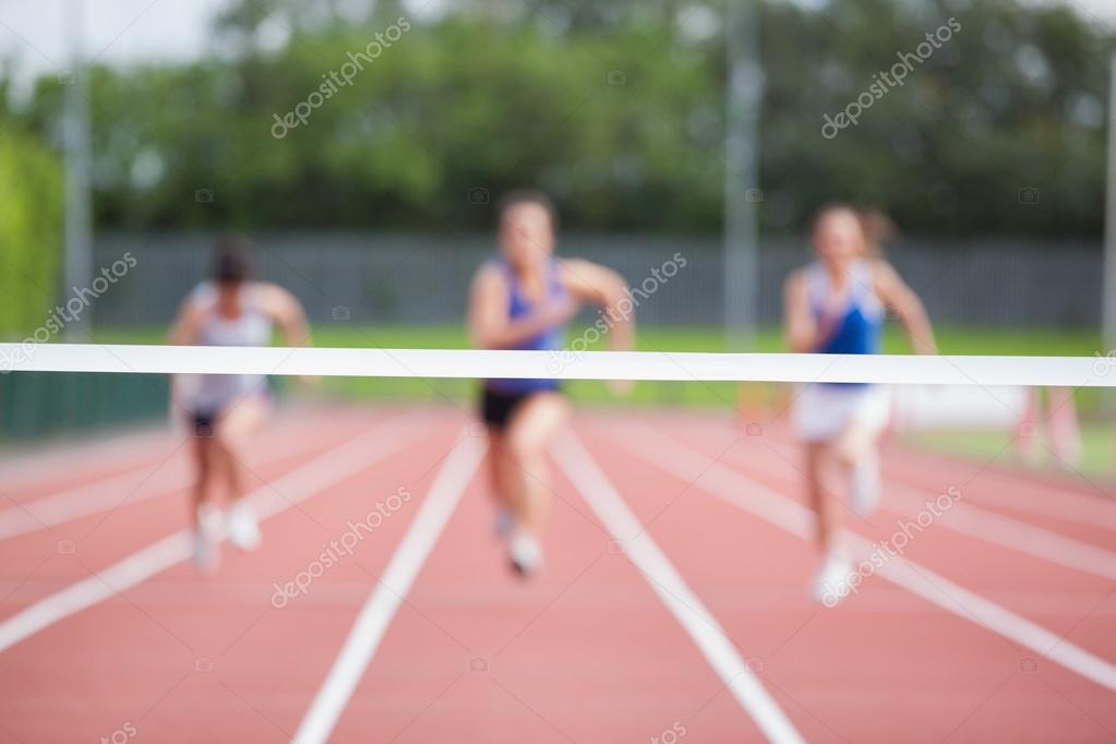 Athletes running towards finish line — Stock Photo © Wavebreakmedia ...