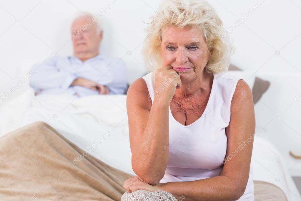 Discouraged old woman sitting on the bed — Stock Photo © Wavebreakmedia ... Discouraged old woman sitting on the bed — Stock Photo © Wavebreakmedia ...