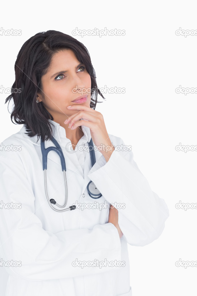 Cute doctor thinking with hand to the chin Stock Photo by ...