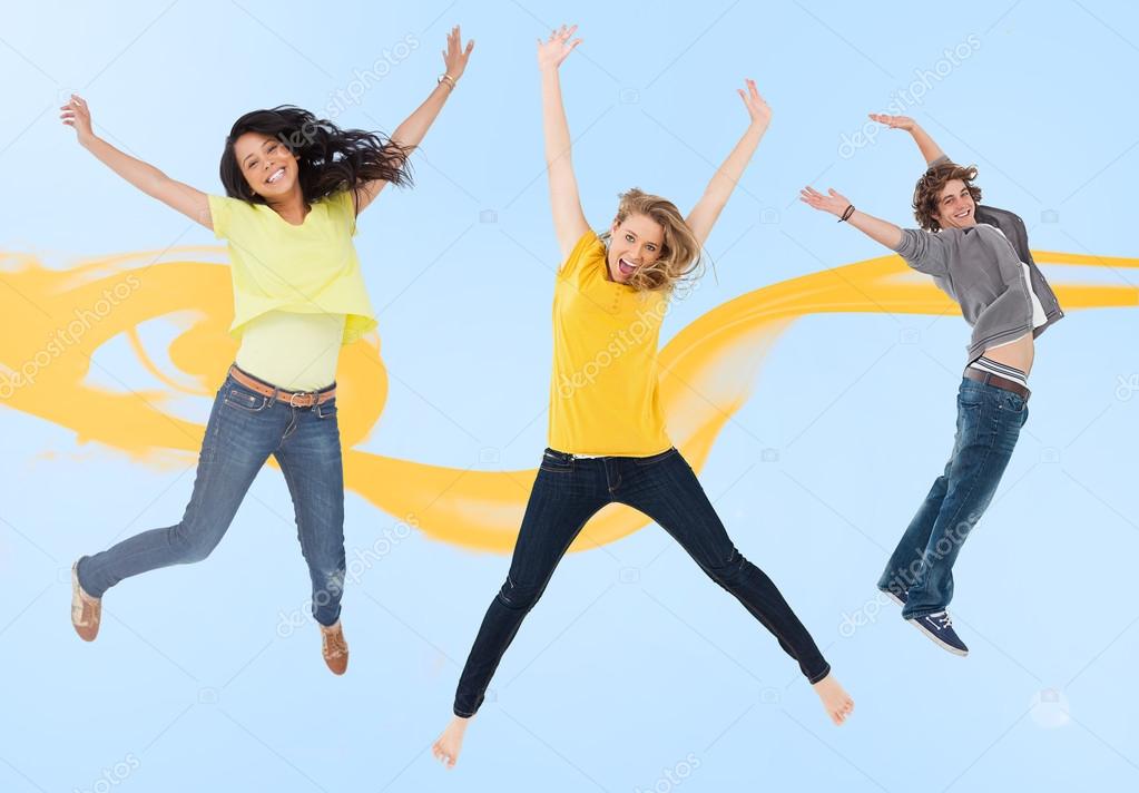 Attractive young man and women jump — Stock Photo © Wavebreakmedia ...