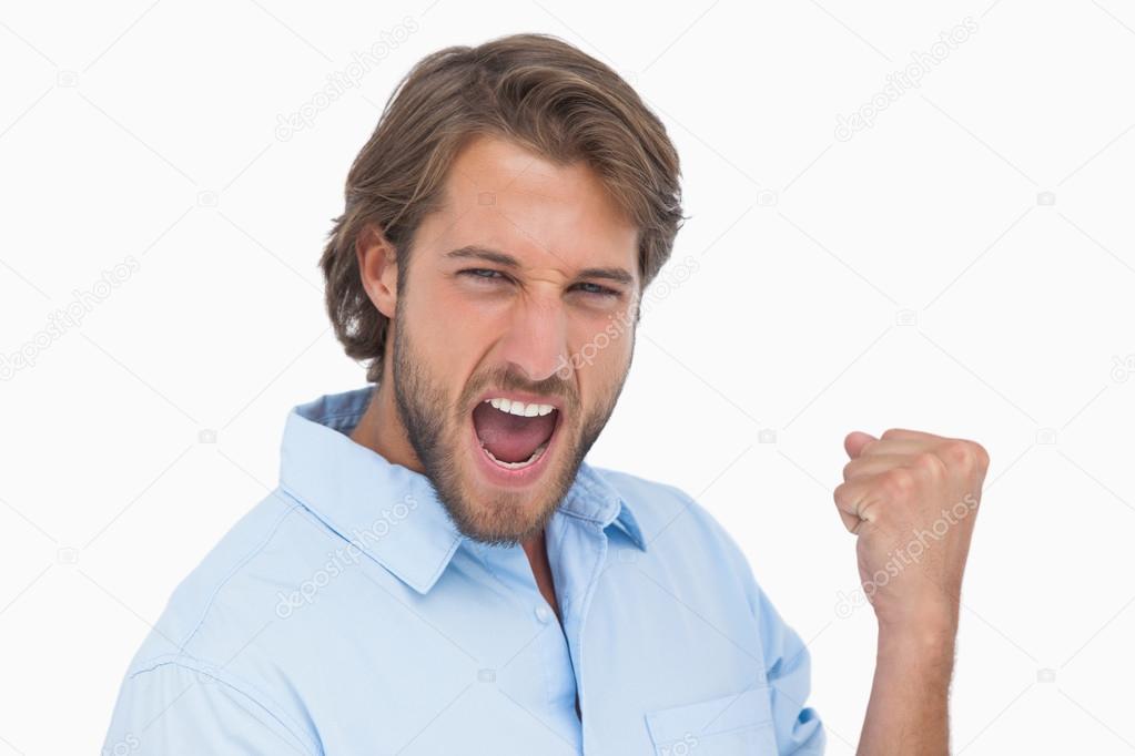 Happy man celebrating success Stock Photo by ©Wavebreakmedia 25723177
