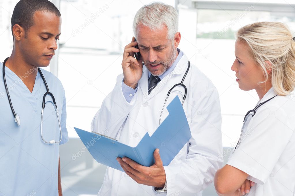 Tres médicos preocupados: fotografía de stock © Wavebreakmedia ...