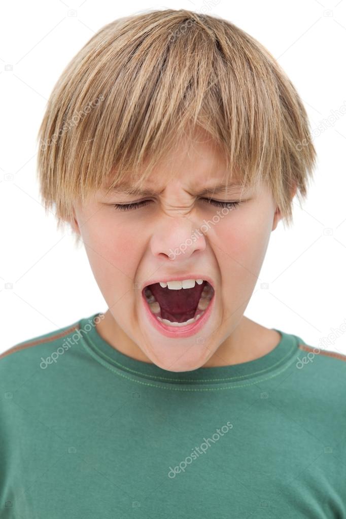 Furious little boy shouting with eyes closed Stock Photo by ...