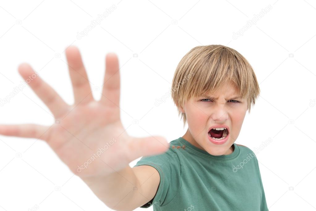 Furious little boy shouting and making stop sign with hand Stock Photo ...