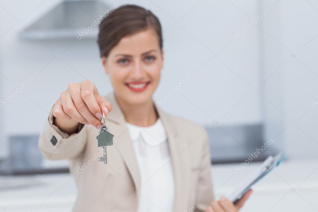 Pretty real estate agent giving house key — Stock Photo ...