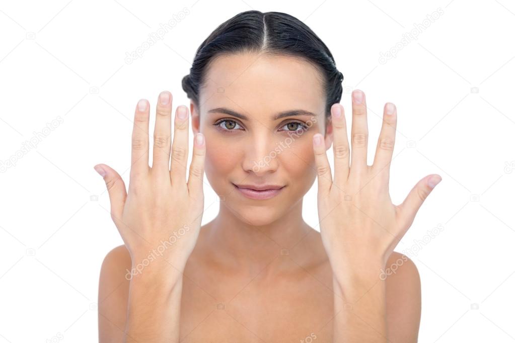 Natural model posing hands up Stock Photo by ©Wavebreakmedia 29449555