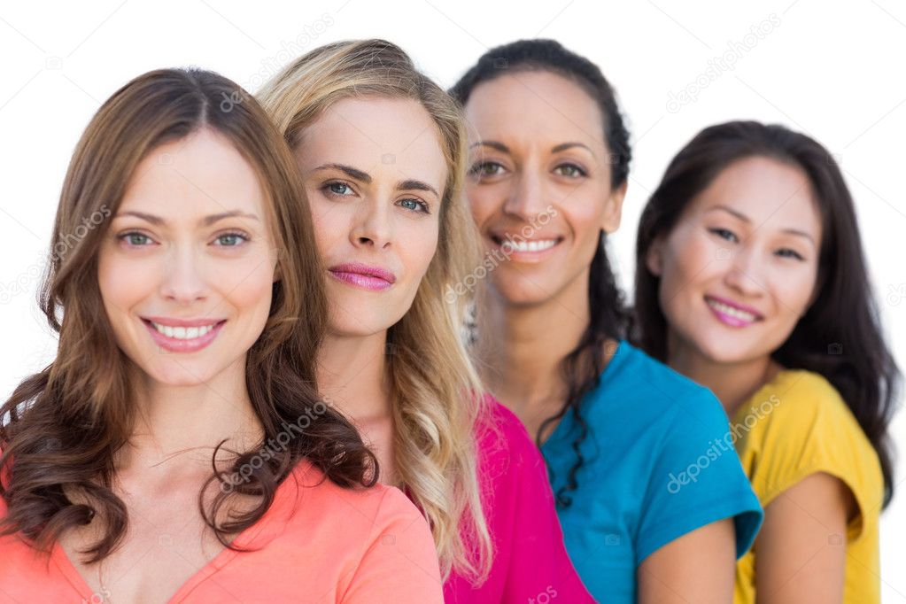 Smiling models in a line posing with colorful t shirts — Stock Photo ...