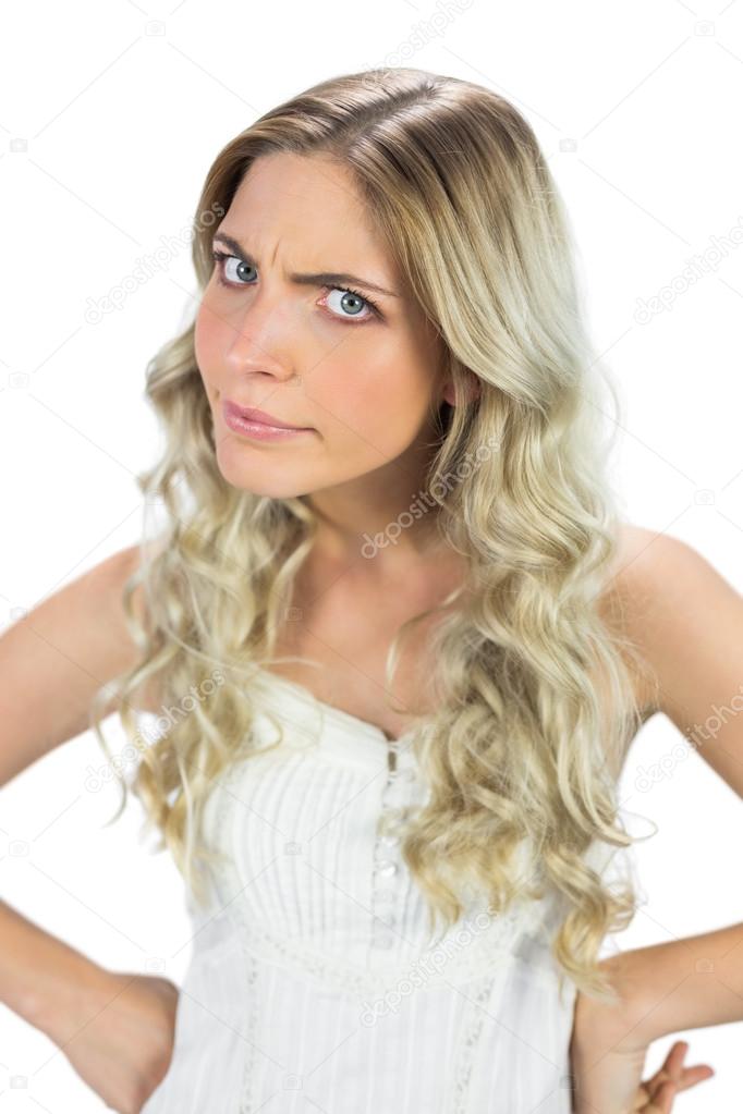 Angry blond model in white dress frowning at camera Stock Photo by ...