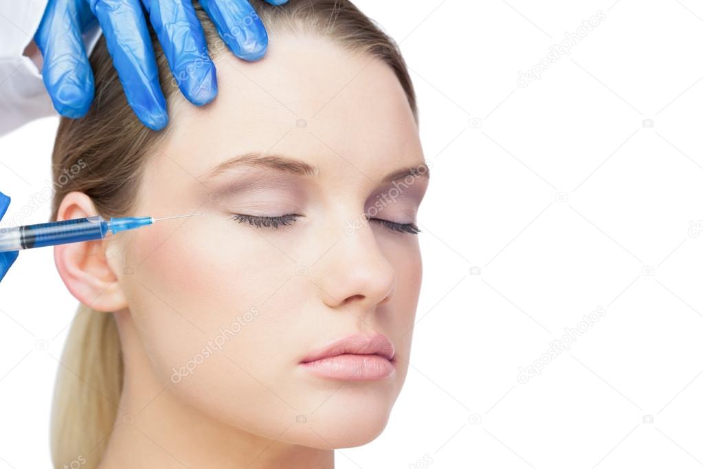 Gorgeous model having botox injection Stock Photo by ©Wavebreakmedia ...