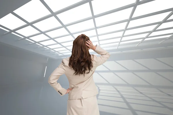 Composite image of businesswoman standing back to camera - Stock Image ...