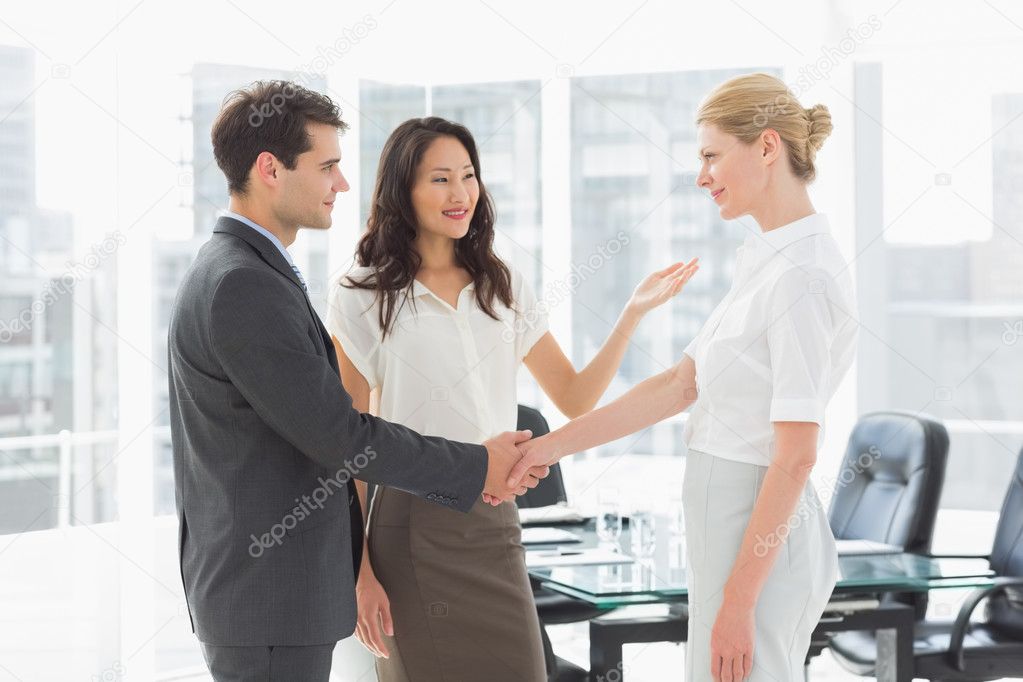 Businesswoman introducing colleagues — Stock Photo © Wavebreakmedia ...