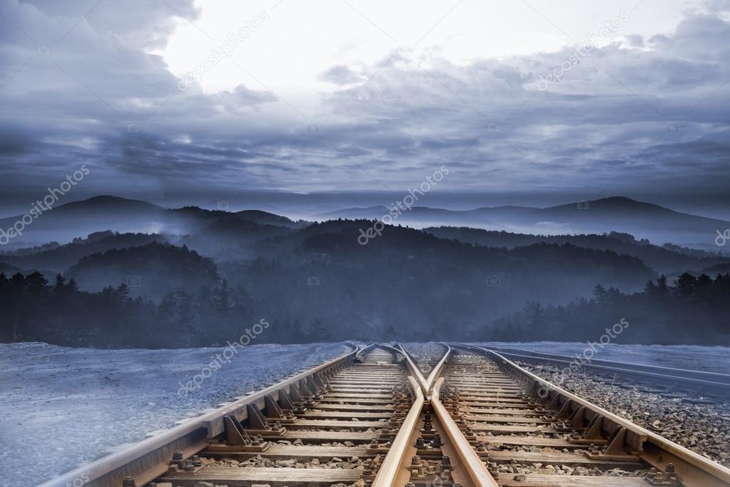 Train tracks leading to misty mountains — Stock Photo © Wavebreakmedia ...