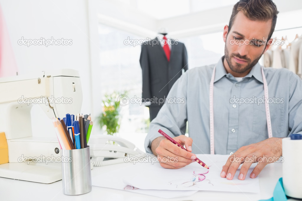 Fashion designer working on his designs in studio — Stock Photo ...