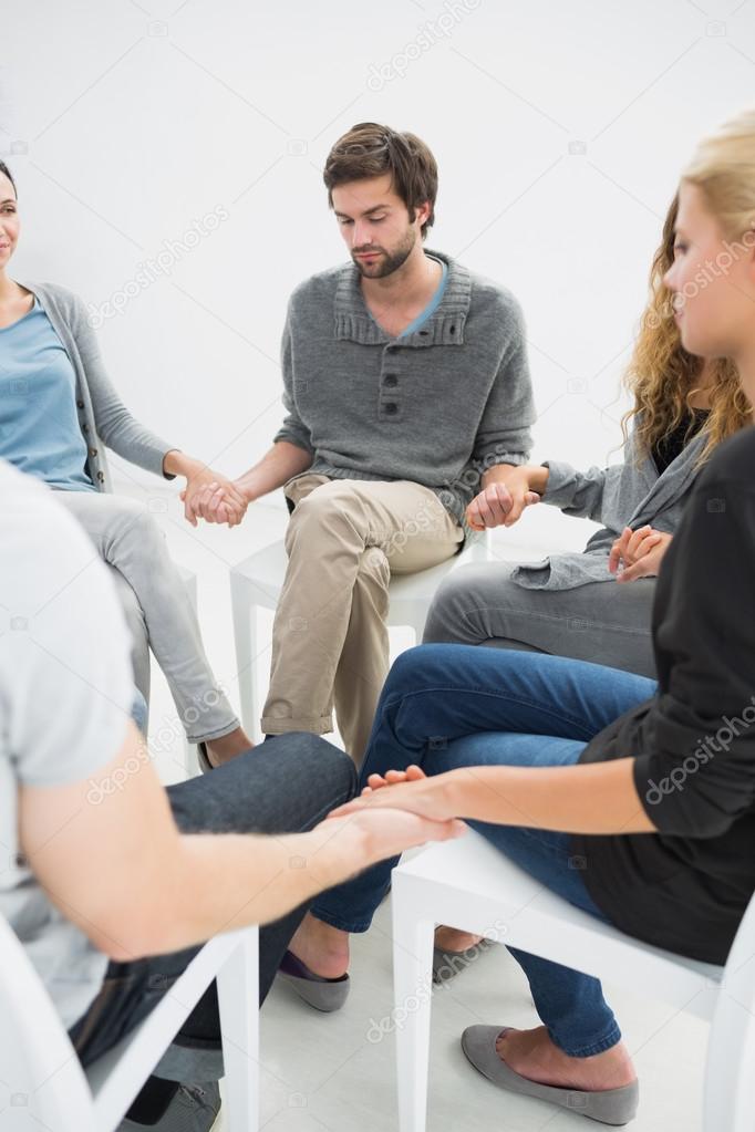 Group therapy in session sitting in a circle Stock Photo by ...