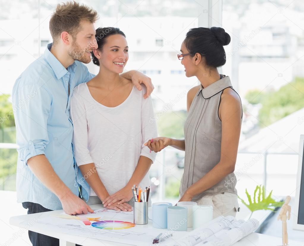 Interior designer speaking with clients Stock Photo by ©Wavebreakmedia ...