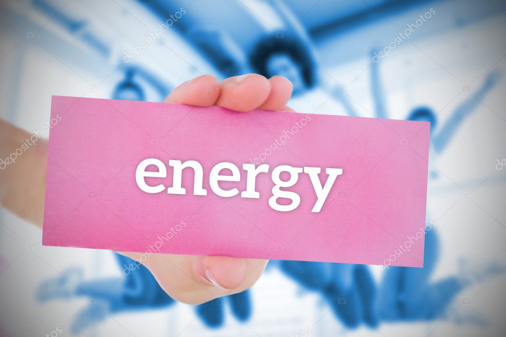 Woman holding pink card saying energy — Stock Photo © Wavebreakmedia ...