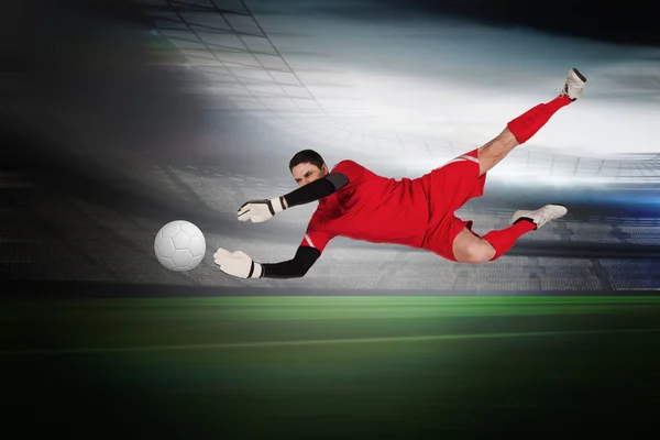 Composite image of fit goal keeper jumping up - Stock Image - Everypixel