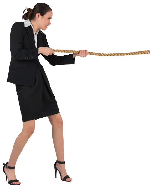 Concentrated Beautiful Businesswoman Pulling Rope Isolated White — Free