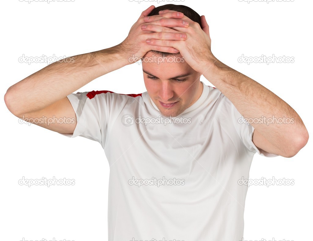 Disappointed football player looking down Stock Photo by ...