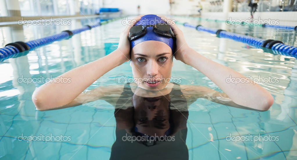 Fit swimmer in the pool smiling Stock Photo by ©Wavebreakmedia 48329295