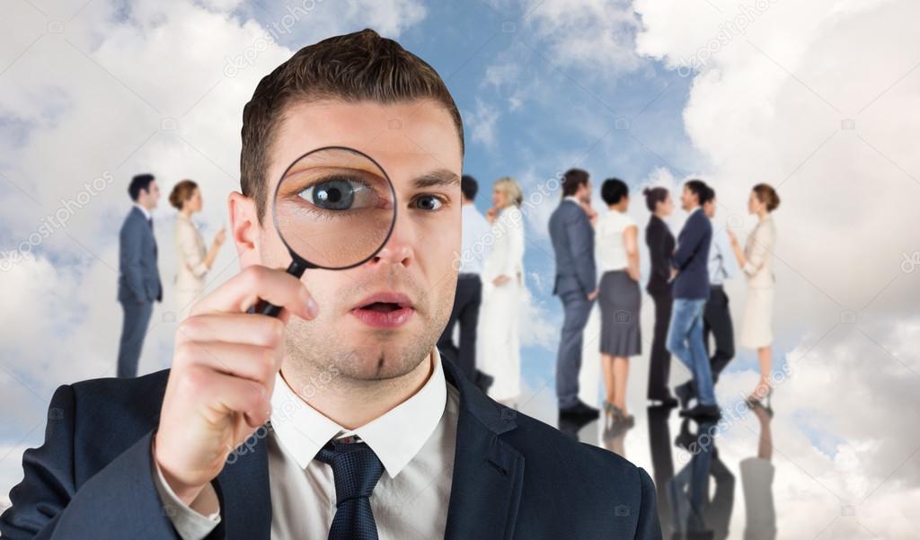 Businessman looking through magnifying glass — Stock Photo ...