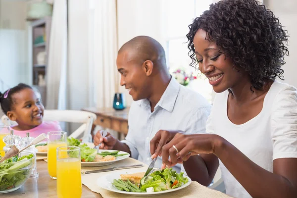 Happy family enjoying a healthy meal together - Stock Image - Everypixel
