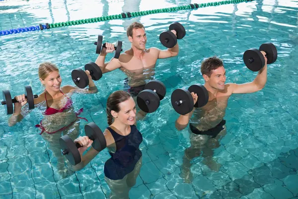 Fitness class doing aqua aerobics — Stock Photo © Wavebreakmedia #50054525